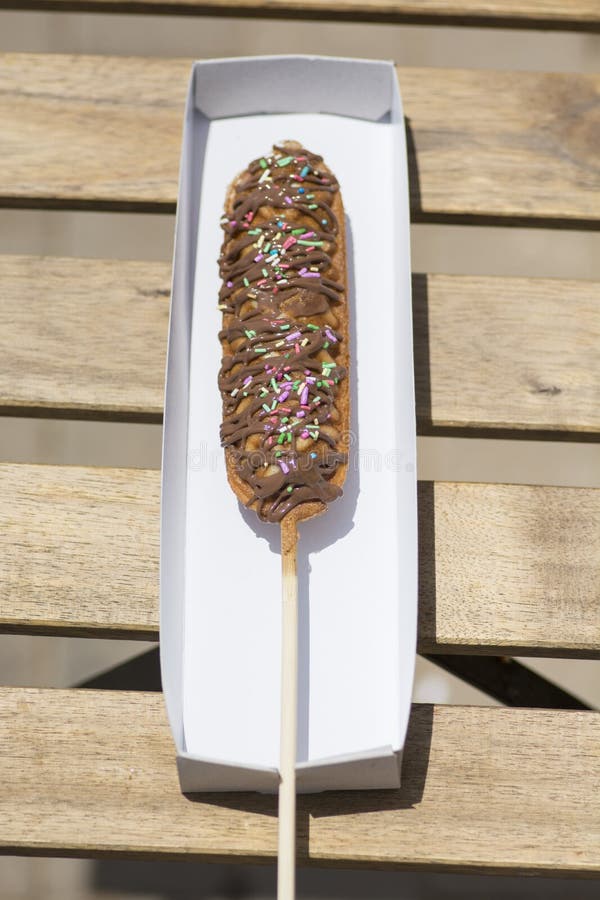 A Waffle on a Stick, Covered with Chocolate and Colorful Candies Stock ...