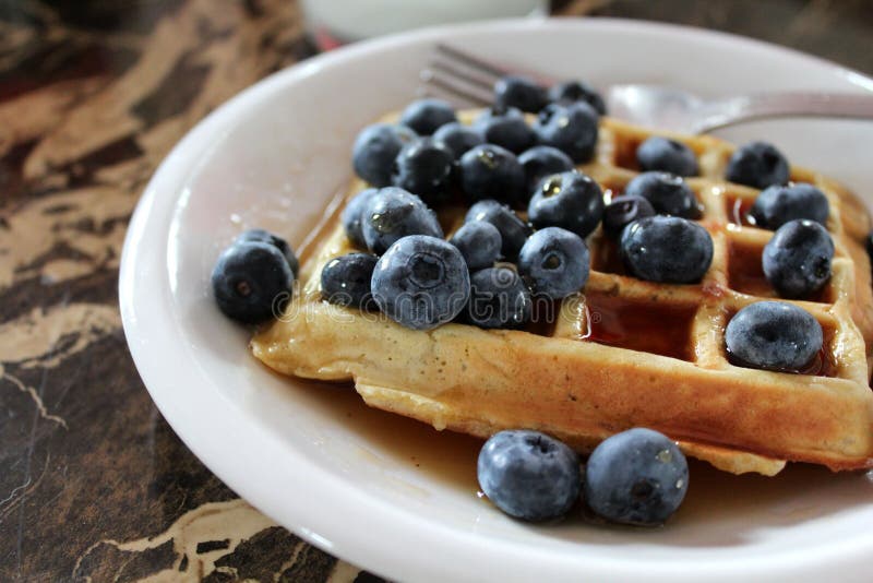 A Waffles with Maple Syrup and Blueberries Stock Photo - Image of ...