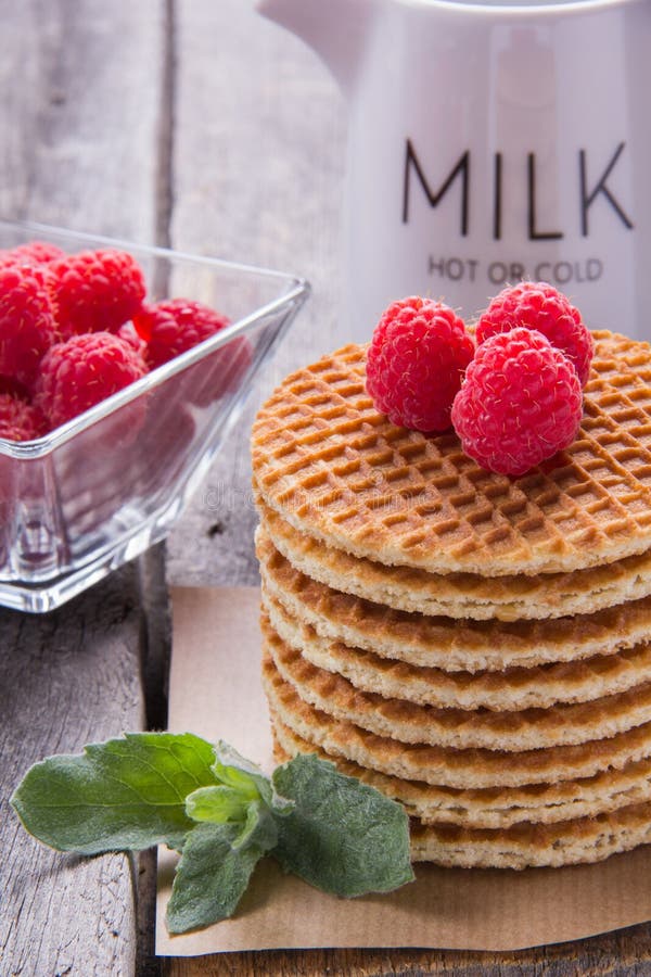Waffles with Raspberries and Milk Tea for Breakfast on a Wooden Stock ...