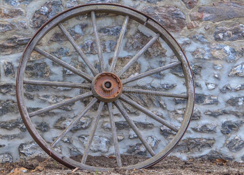 Wagon wheel stock image. Image of wooden, leaning, rural - 89724323