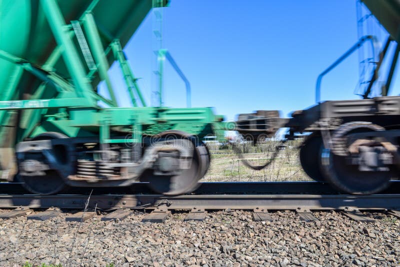 Wagons of a Freight Train Moving Fast Along the Rails Stock Photo ...