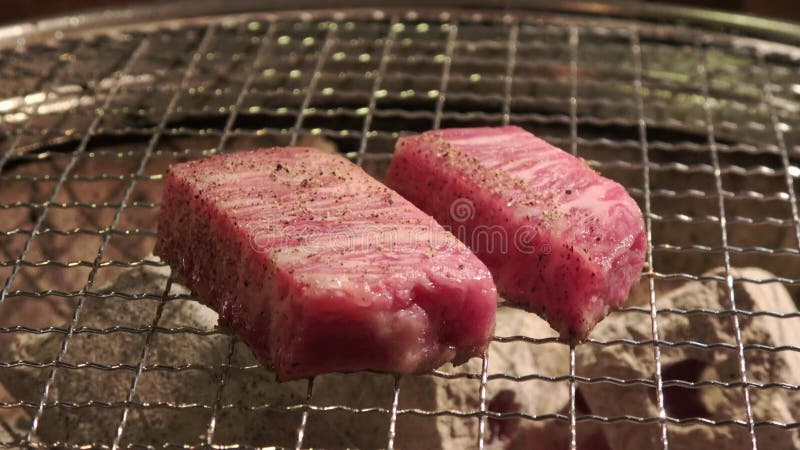 Wagyu Beef from Japan with Consistent Marbling is Being Cooked Over a ...