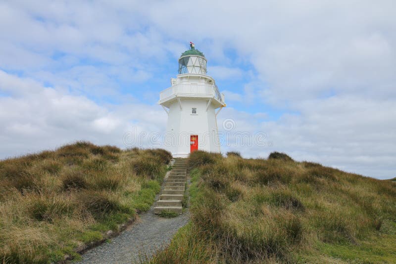 Waipapa Point Lighthouse with a Cloudy Sky Stock Photo - Image of used ...