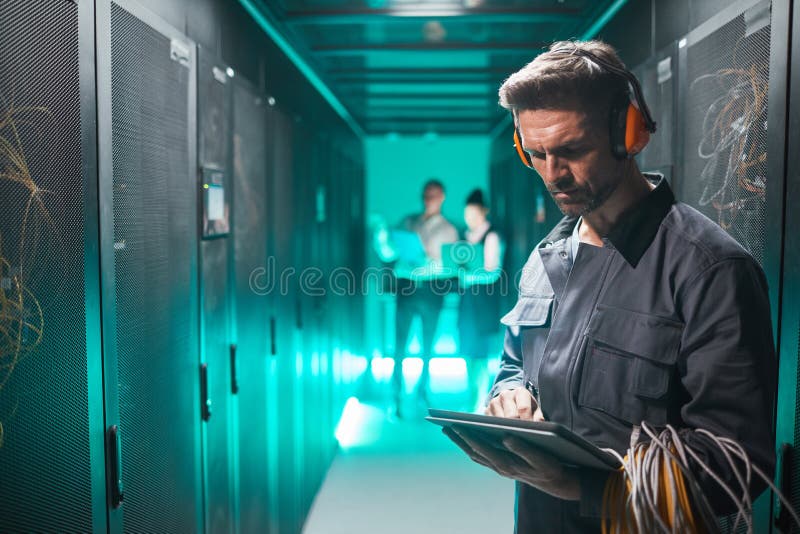 Portrait of Network Engineer in Server Room Stock Image - Image of data ...