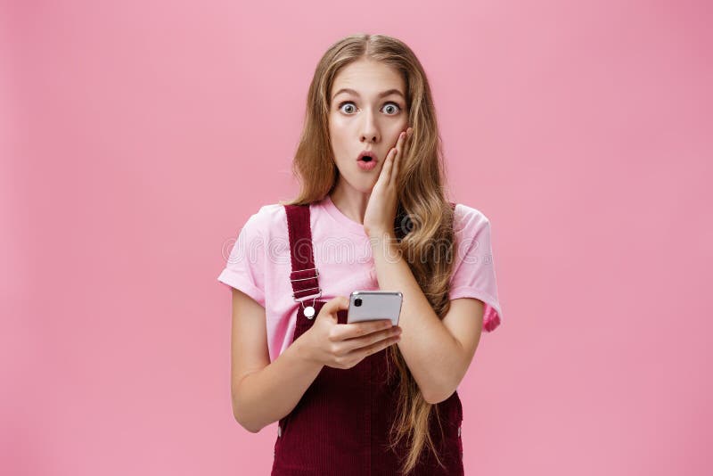 Waist Up Shot Of Surprised Amazed Stunned Young Slender Woman With Wavy