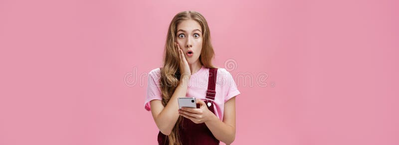 Waist Up Shot Of Surprised Amazed Stunned Young Slender Woman With Wavy