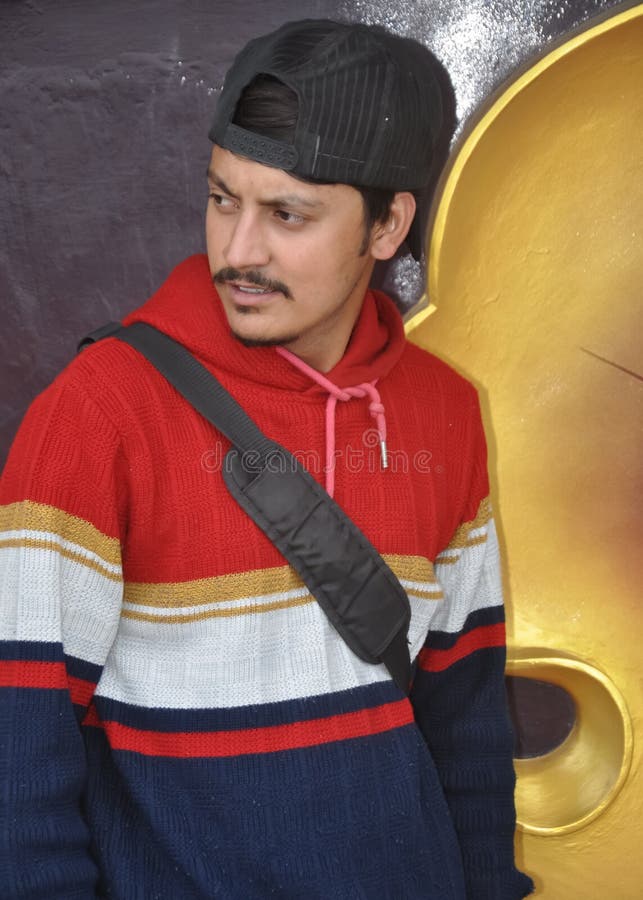 Waist-up of a Young Guy Wearing Cap Backwards with Looking Sideways ...