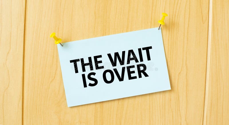 The Wait is Over Sign Written on Sticky Note Pinned on Wooden Wall ...