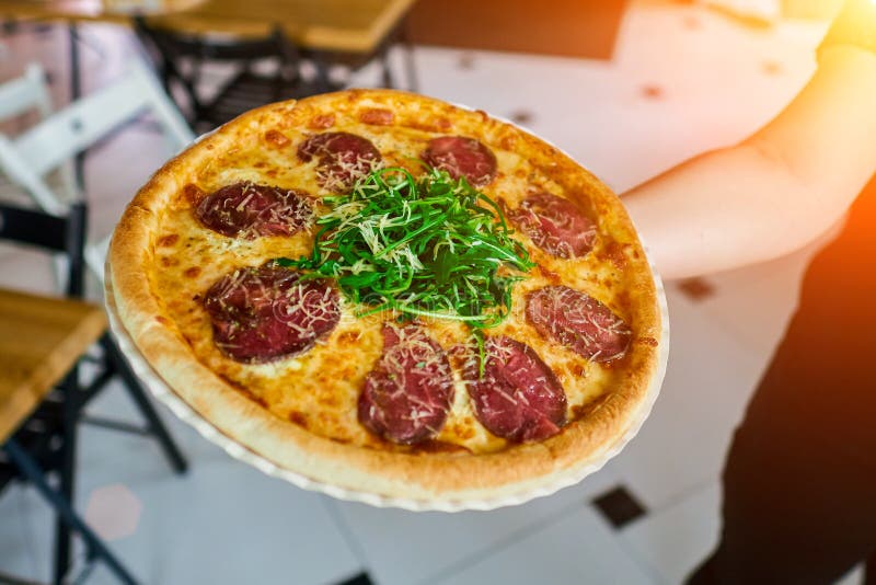 The Waiter Carries the Pizza To the Client Stock Image - Image of ...
