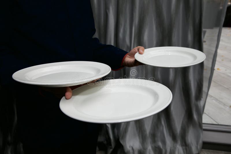 Waiter Carrying Three Plates Stock Photo - Image of industry, work ...