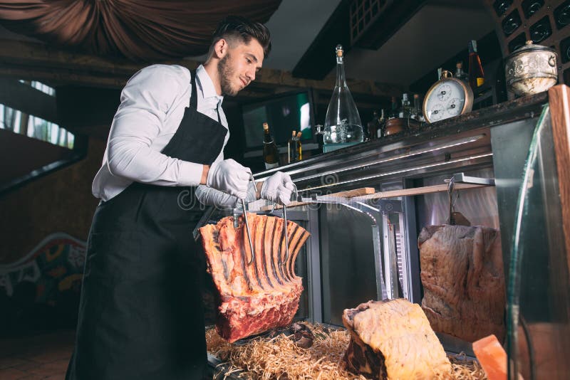 The Waiter or Cook Gets Dry Meat in the Refrigerator. Stock Photo ...
