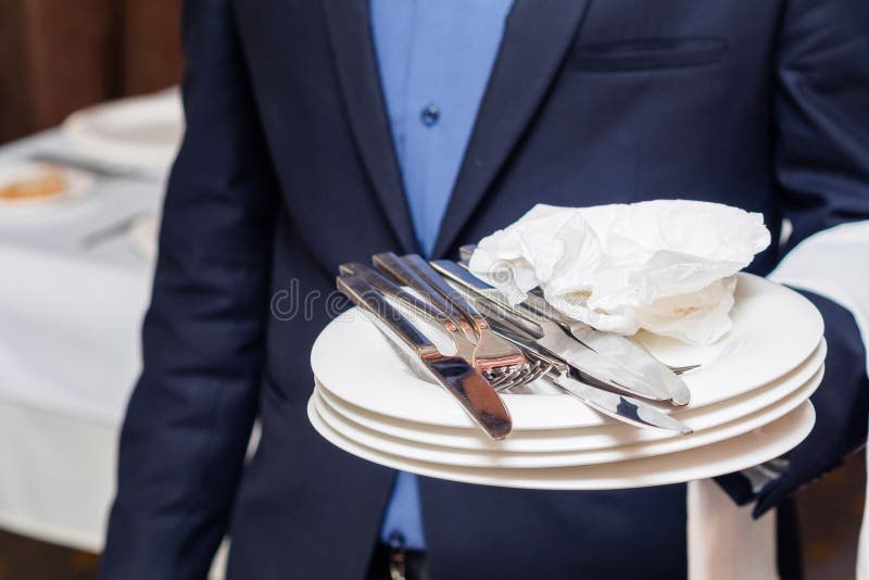 The Waiter with the Dirty Forks and Plates Stock Photo - Image of knife ...