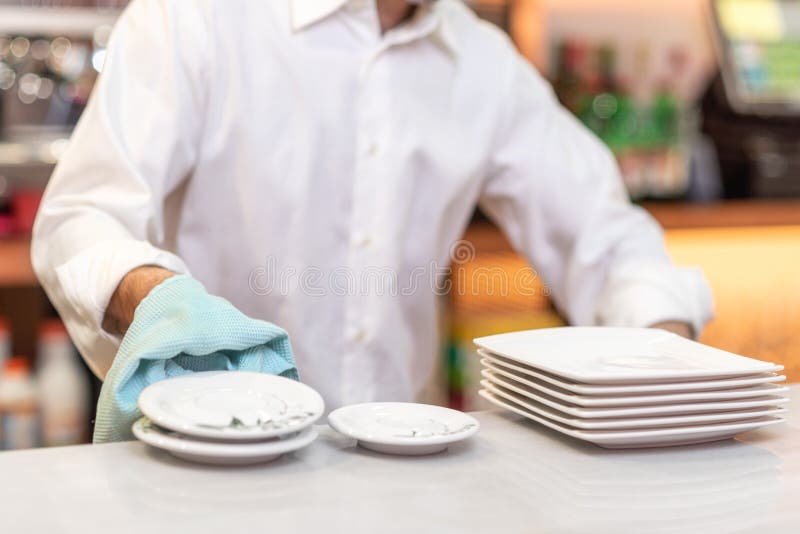 Waiter Drying Dishes in the Restaurant. Stock Photo - Image of side ...