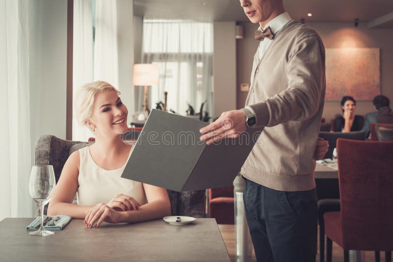Waiter Explaining Menu To Elegant Woman Restaurant Stock Photos - Free ...