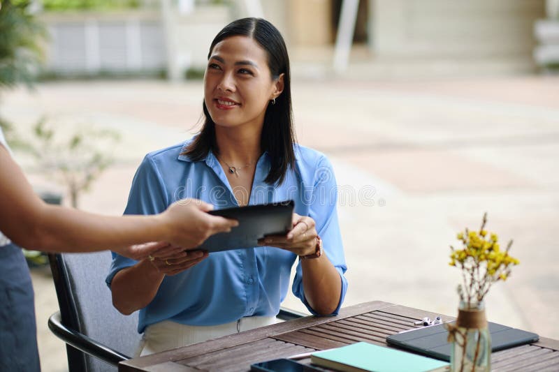 Waiter Giving Cafe Menu stock photo. Image of entrepreneur - 311770382