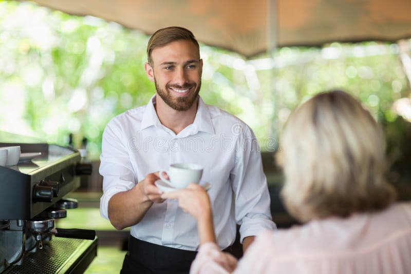Waiter Giving Coffee To Customer Stock Photo - Image of hotel, giving ...