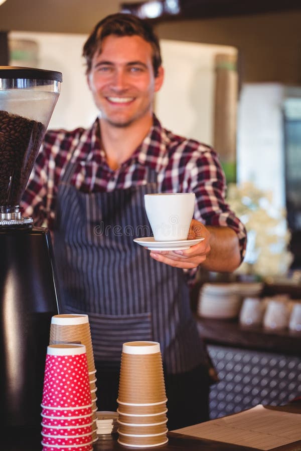 Waiter Handing Over a Coffee Stock Photo - Image of restaurant, coffee ...
