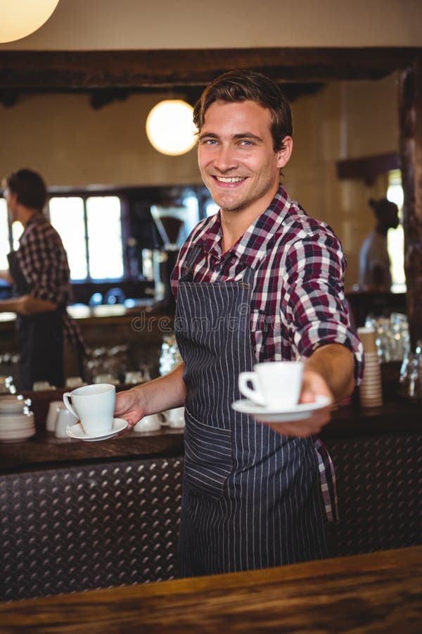 Waiter Handing Over a Coffee Stock Photo - Image of retail, food: 73242758