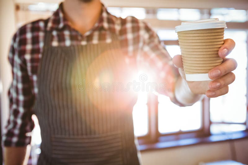 Waiter Handing The Bill To Smiling Customers In A Bar Stock Image ...