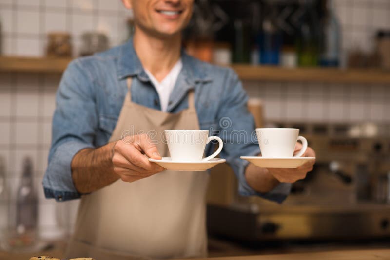 Waiter Holding Cups of Coffee Stock Photo - Image of caucasian, closeup ...