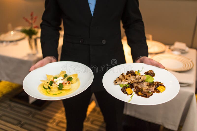 Waiter Serving Plates Food Stock Photos - Download 379 Royalty Free Photos