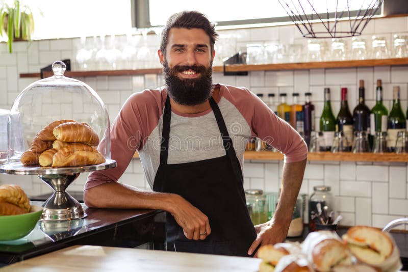 Waiter Leaning Against Counter Stock Photo - Image of apron ...