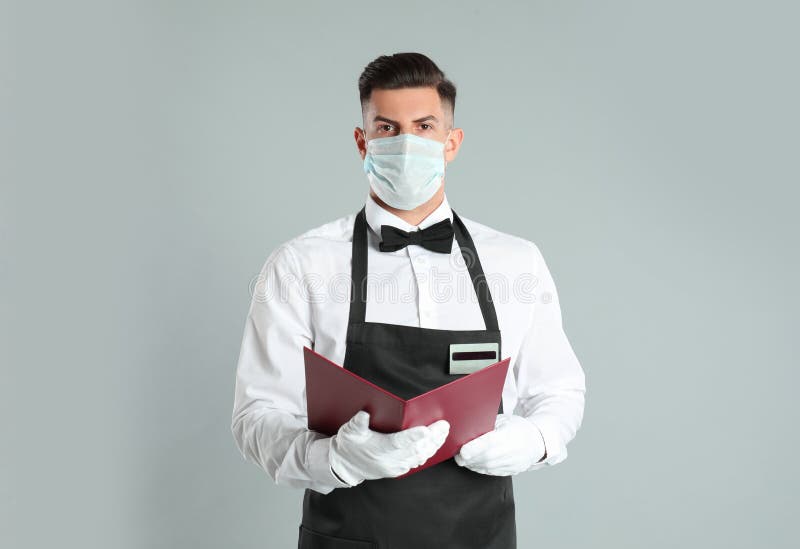 Waiter in Medical Face Mask with Menu on Light Grey Background Stock ...