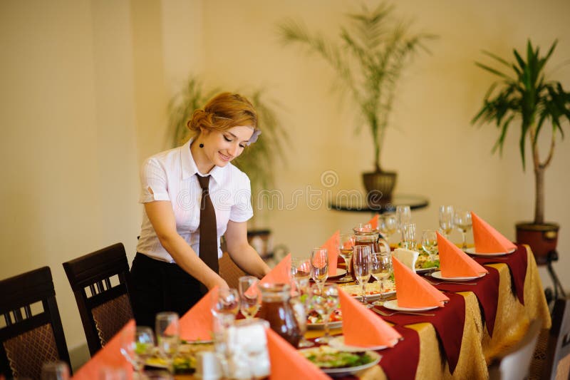 Waiter Near the Table with Food Stock Photo - Image of beer, restaurant ...