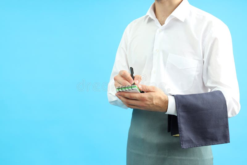 Waiter with Notebook on Blue Background, Space for Text Stock Photo ...