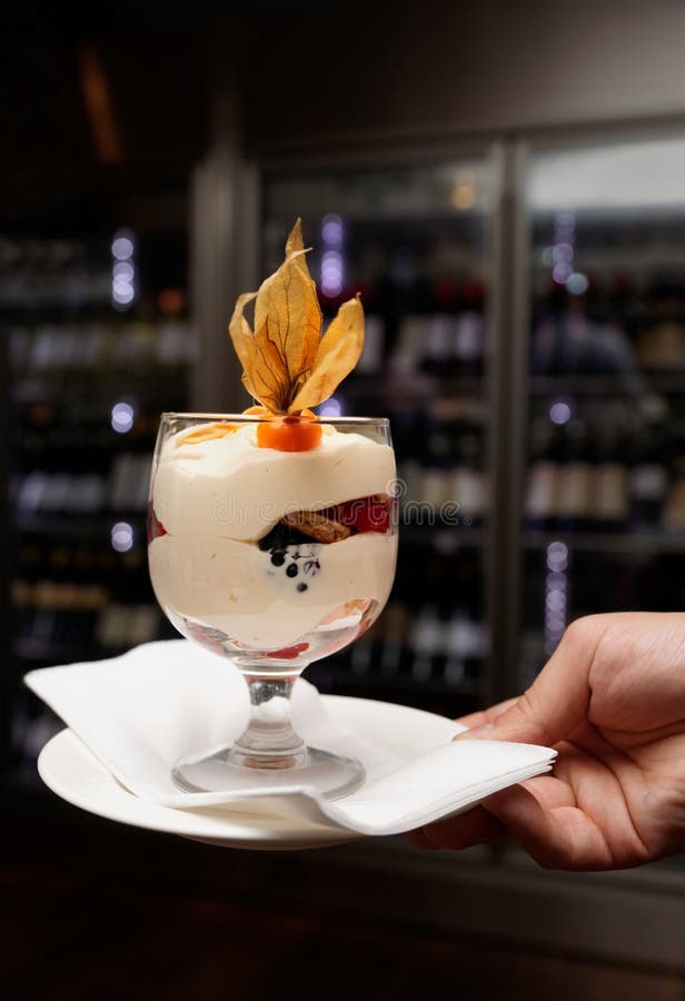 Waiter offering dessert stock image. Image of service - 32631871