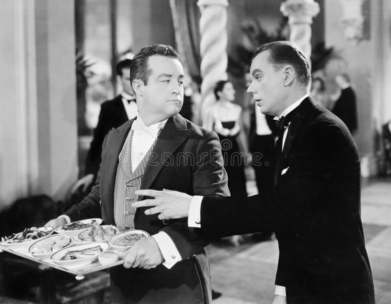 A Waiter and Patron at a Gala Event Stock Photo - Image of industry ...