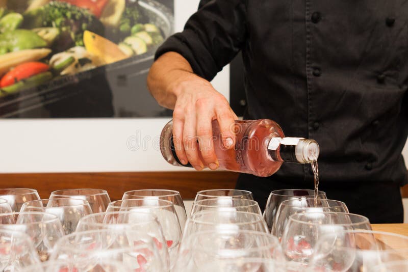 Waiter pouring gin stock image. Image of vineyard, white - 75161919