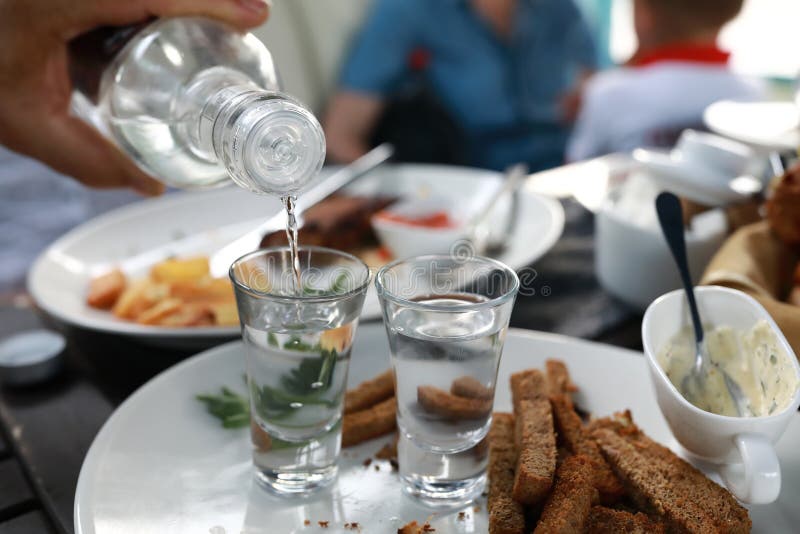 Waiter Pouring Vodka into Glasses Stock Image - Image of addiction ...