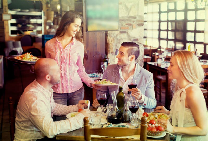 Waiter with Restaurant Guests at Table Stock Photo - Image of country ...