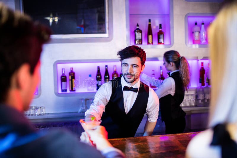 Waiter serving cocktail stock photo. Image of male, beverage - 77692708