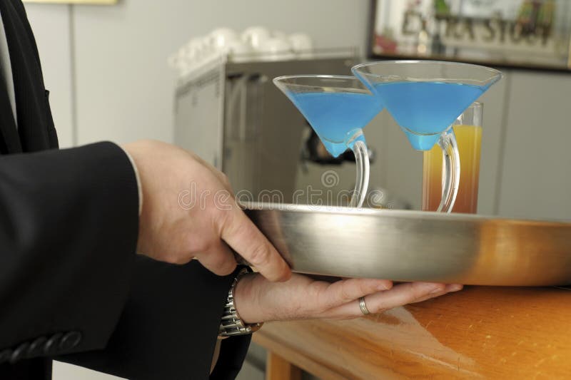 Waiter serving cocktails stock photo. Image of waiter - 23708936