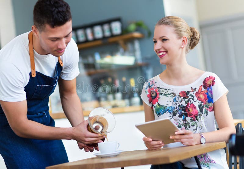 Waiter serving customer stock photo. Image of apron, consumer - 61119904