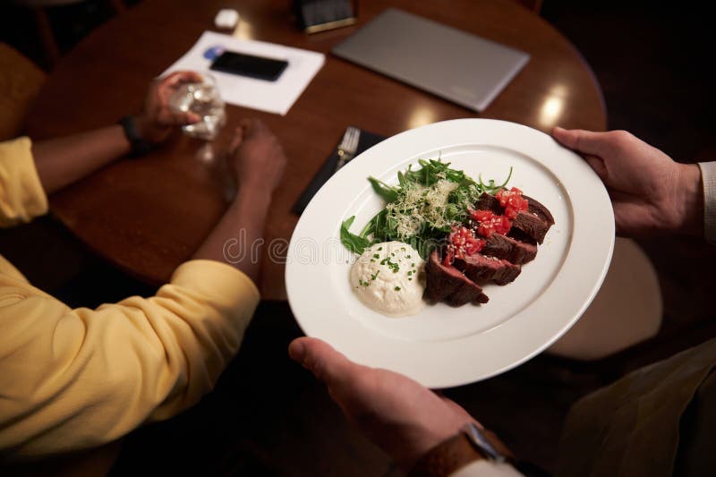 Waiter Serving Dinner for Customer Stock Photo - Image of professional ...