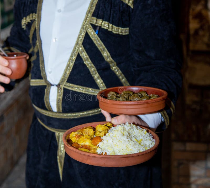 Waiter Serving a Meaty Dish with Rice in a Restaurant Stock Image ...