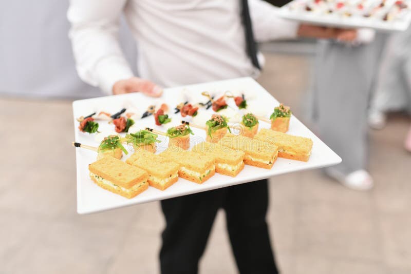 A Waiter Serving Small Appetizers at a Wedding Stock Image - Image of ...