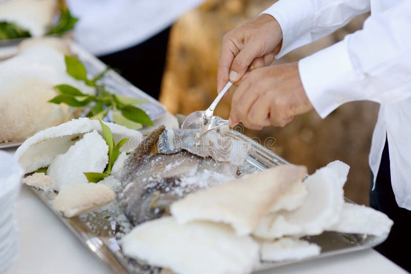 Waiter Serving a Tasty Fish Stock Photo - Image of food, dining: 28910810