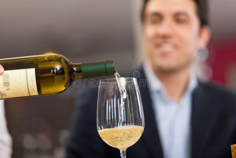 Waiter pouring wine stock image. Image of confident, serving - 30129029