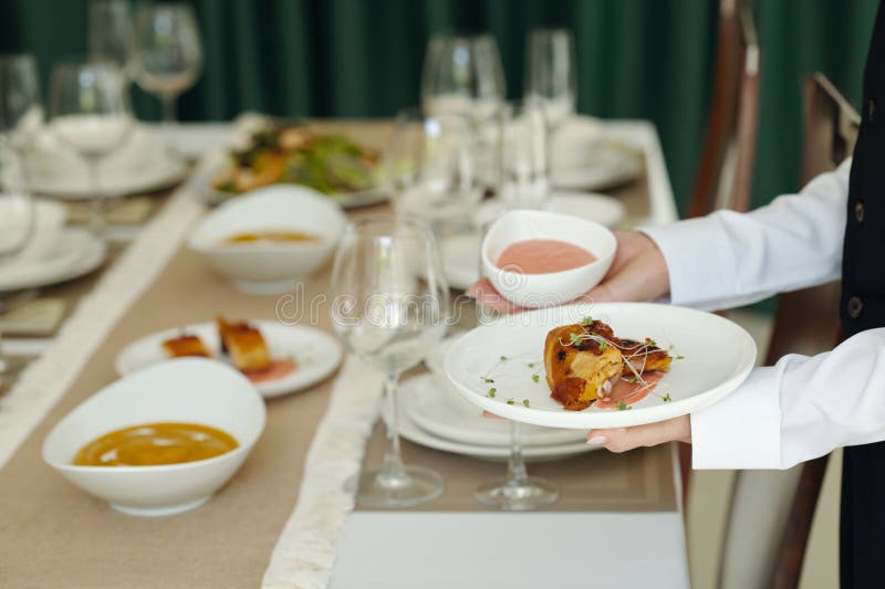 Waiter Setting Delicious Dishes Table Stock Photos - Free & Royalty ...