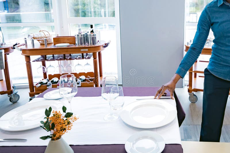 Waiter Setting an Elegant Restaurant Table Stock Image - Image of ...
