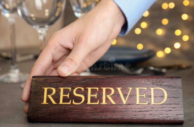 Waiter Setting RESERVED Sign on Restaurant Table Stock Image - Image of ...