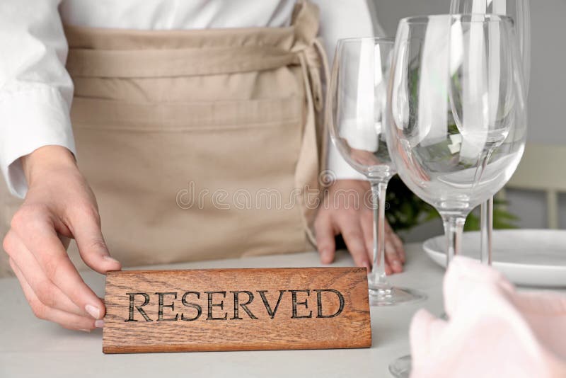 Waiter Setting RESERVED Sign on Restaurant Table Stock Photo - Image of ...