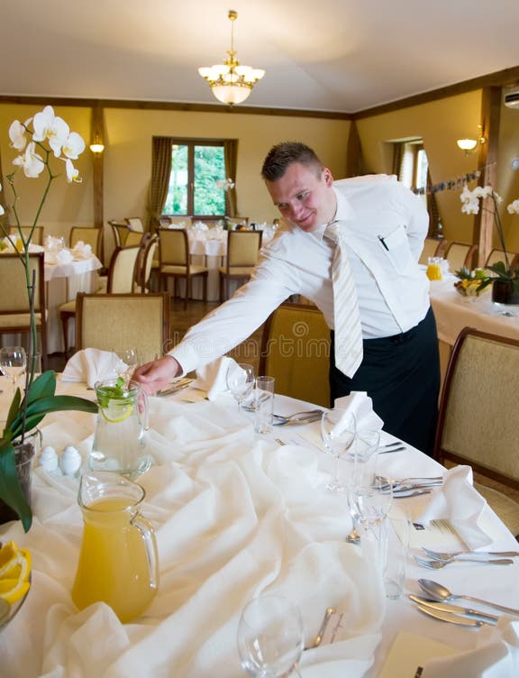 Waiter setting table stock image. Image of buffet, decorative - 5859159