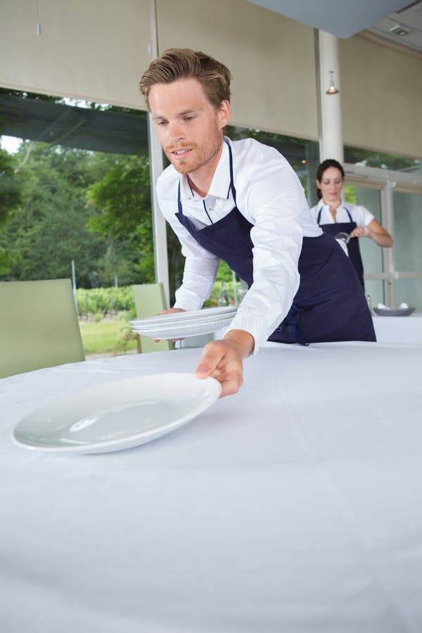 Waiter Setting Table in Restaurant Stock Photo - Image of lunch, woman ...