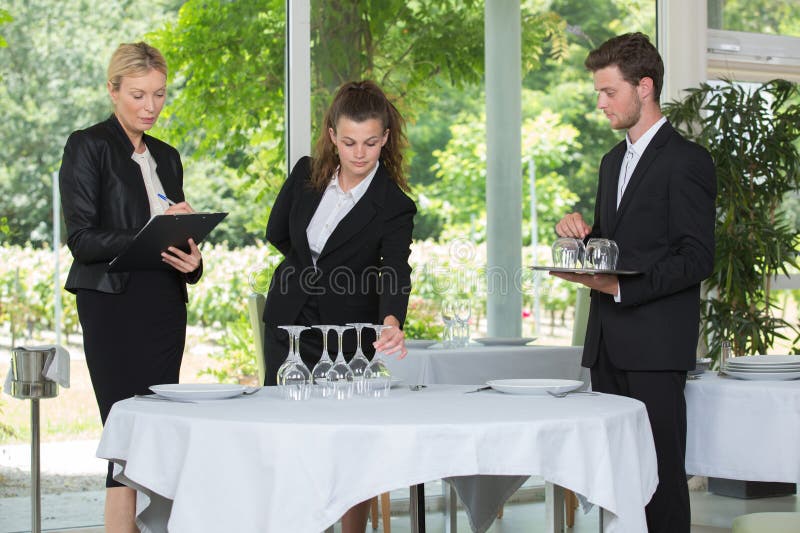 Waiter Setting Table in Bar Stock Image - Image of bowtie, male: 271108189