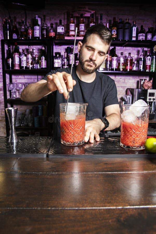 A Waiter Stirs a Glass of Cocktail Over a Bar Counter Stock Image ...